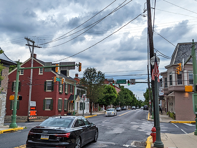 Main Street stretches into the distance under moody skies, a perfect small-town tableau that Norman Rockwell would've rushed to capture on canvas.