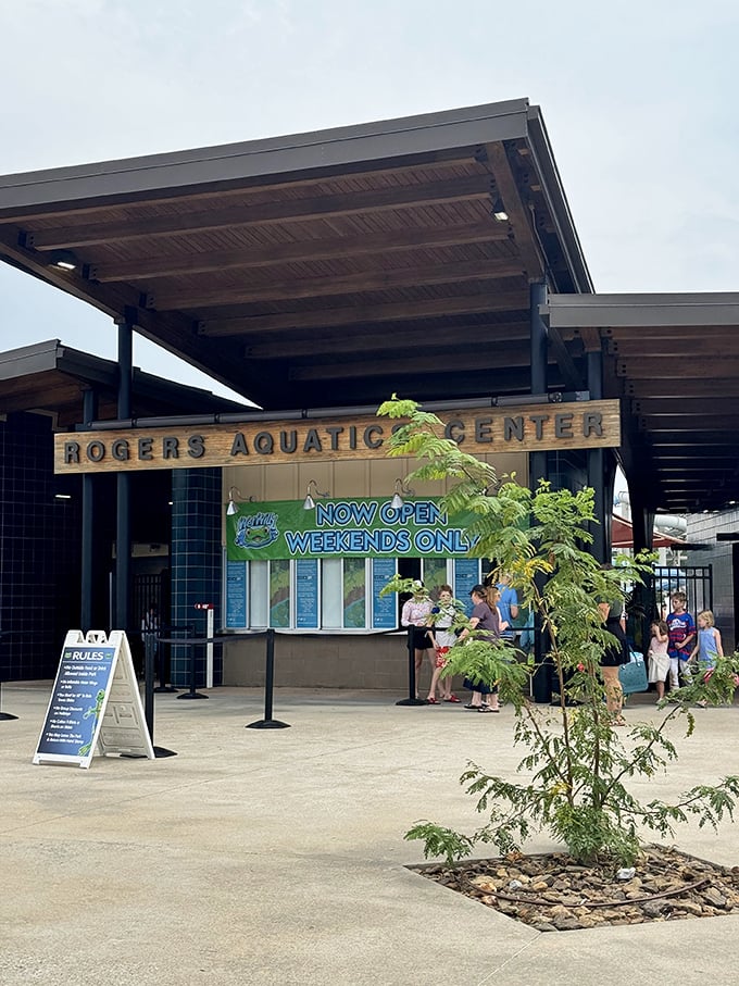 Modern architecture meets water wonderland at the entrance. That "Weekends Only" sign is the aquatic equivalent of "while supplies last" &ndash; creating urgency since forever.