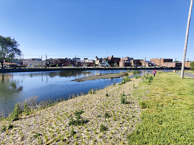 The Auglaize River reflects downtown's historic buildings, offering a peaceful moment to contemplate how water has shaped this community for generations.