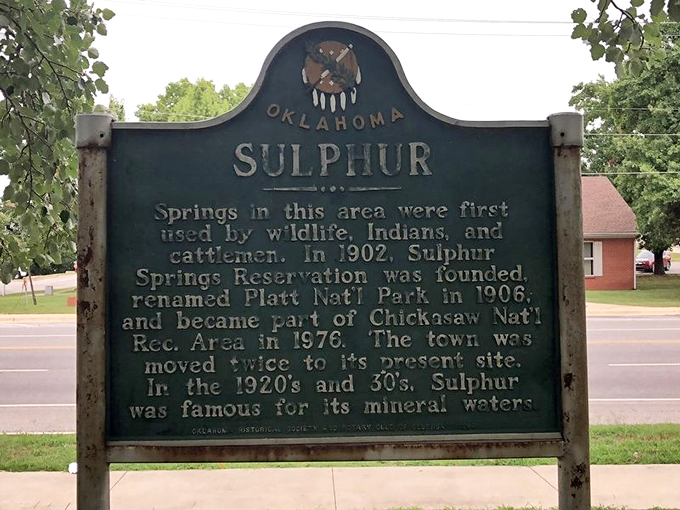 History speaks through this weathered green sign, telling tales of mineral springs that drew wildlife, Native Americans, and eventually created a town that moved&mdash;twice!&mdash;for its magical waters.