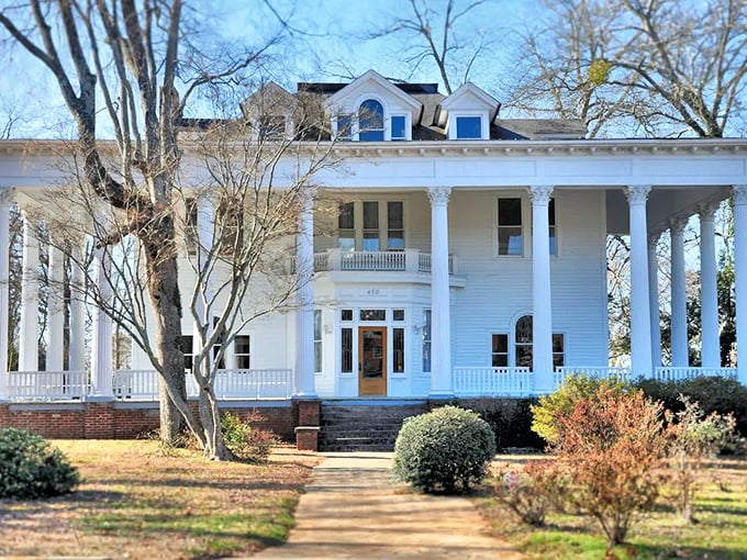 This grand white colonial isn't just showing off&mdash;it's telling stories about a time when front porches were social networks and columns meant something.