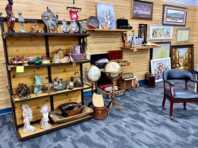 Every shelf tells a story in this home d&eacute;cor section, where globes, figurines, and framed artwork await their second chapter in someone's home.