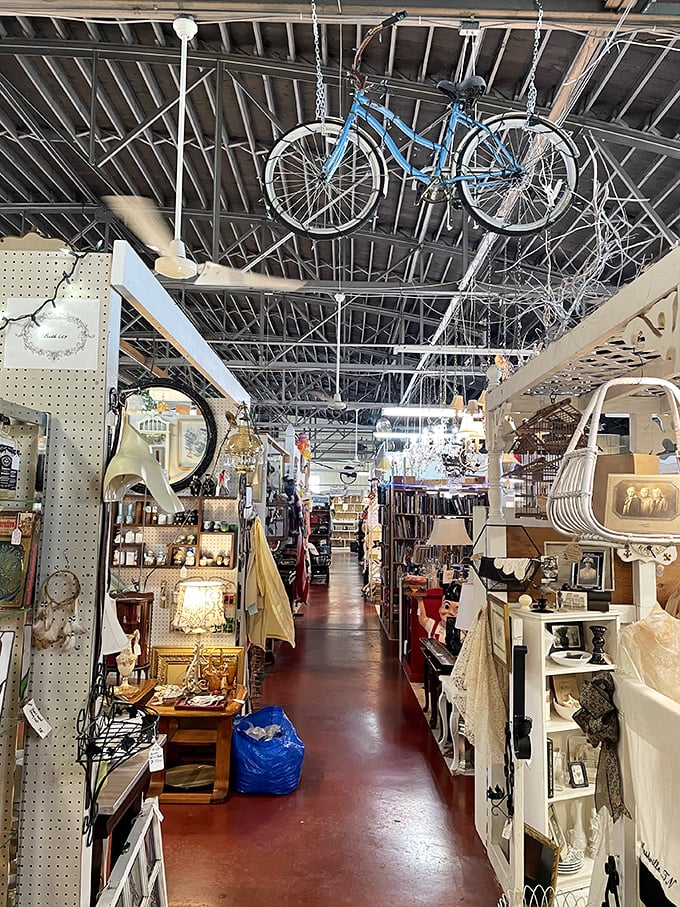 Every aisle tells a different story as vintage-draped booths create a labyrinth where the past is meticulously categorized and lovingly displayed.