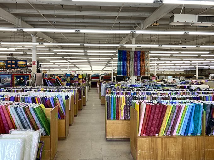 Rows upon rows of fabric bolts create a textile rainbow that would make Joseph and his technicolor dreamcoat green with envy.