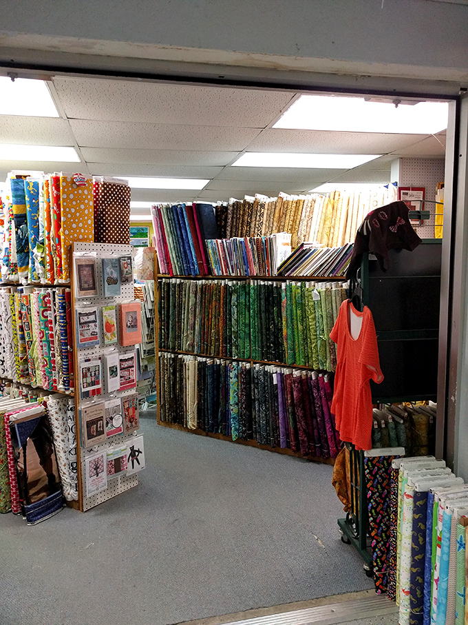 Step inside and witness the rainbow explosion of fabrics that will have you mentally redecorating your entire house in under five minutes.