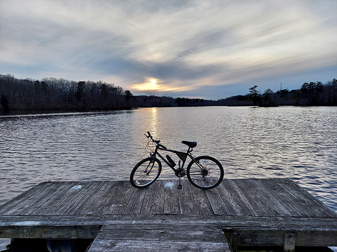 Bike meets sunset at the perfect moment. If this dock could talk, it would whisper, "Stay awhile, the office emails can wait."