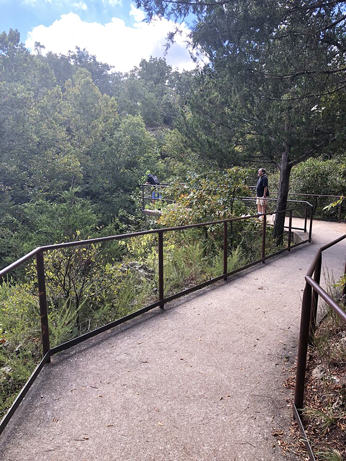 Nature's balcony awaits. The well-maintained observation deck offers visitors front-row seats to one of Oklahoma's most dramatic natural performances.