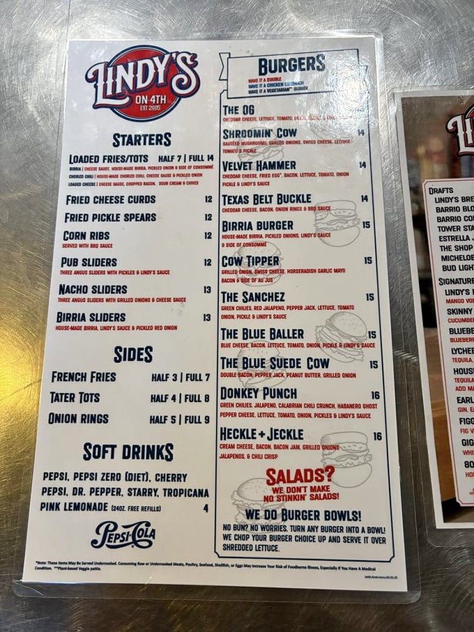 A menu that proudly proclaims "NO STINKIN' SALADS!" tells you everything about Lindy's priorities. This is a sanctuary for the burger faithful.