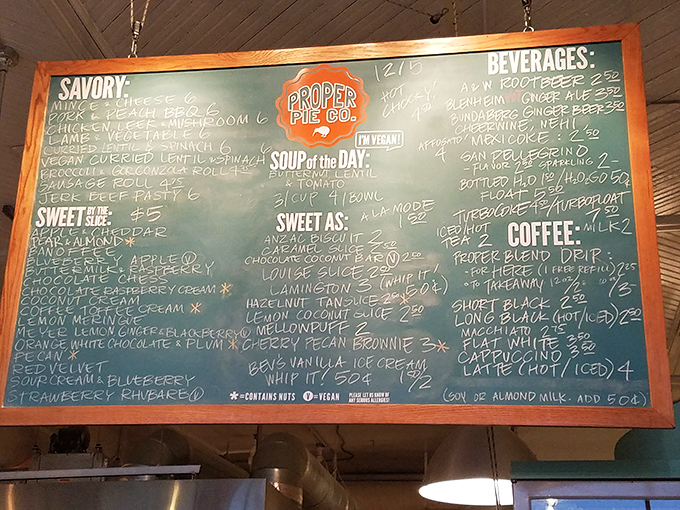 A chalkboard of dreams. Each chalky scribble represents a potential life-changing pie experience, from savory New Zealand classics to sweet Southern favorites.