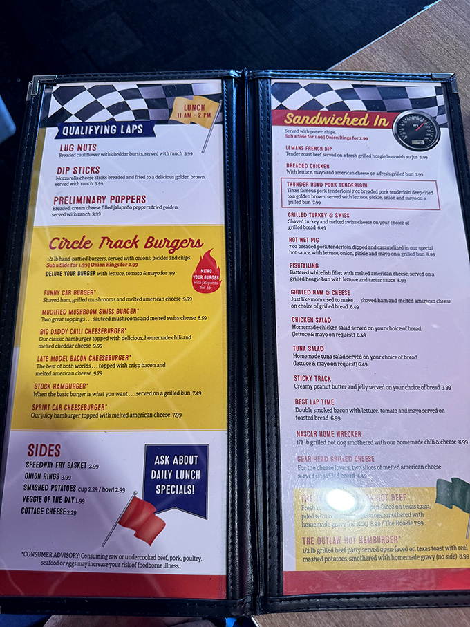 The racing-themed menu transforms ordering into a delightful pit stop, with "Circle Track Burgers" and "Qualifying Laps" appetizers.