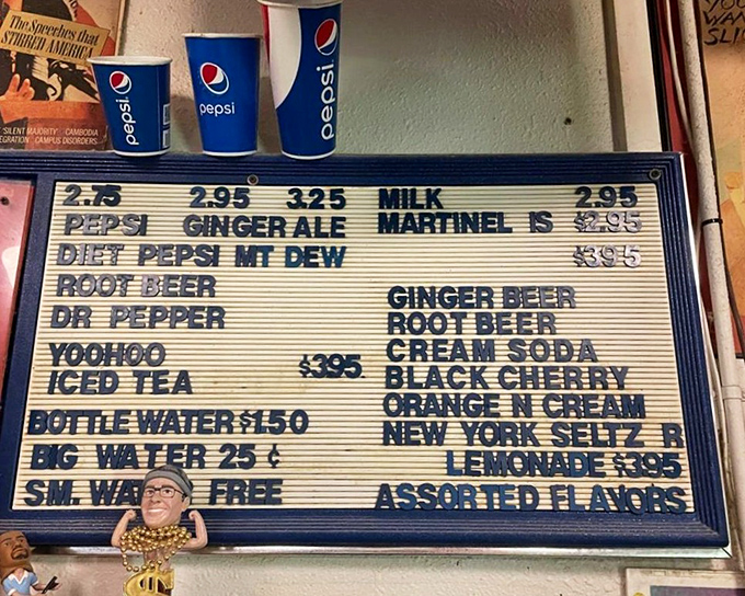 The old-school menu board doesn't offer forty-seven artisanal combinations, just straightforward options that remind you why pizza became popular. 