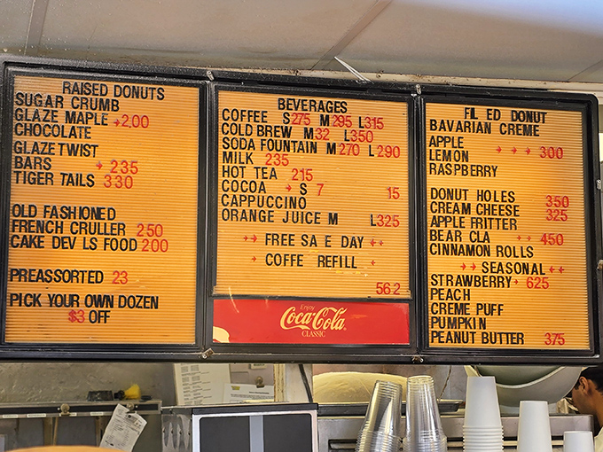 The menu board is like a treasure map where X marks the spot for strawberry-stuffed gold. Choose your own adventure in donut form.