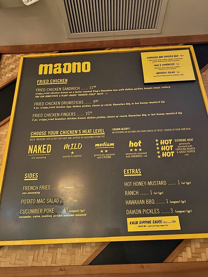 The menu board at Ma'ono reads like a love letter to fried chicken, with heat levels ranging from "I'm just here for the flavor" to "I enjoy making questionable life decisions."