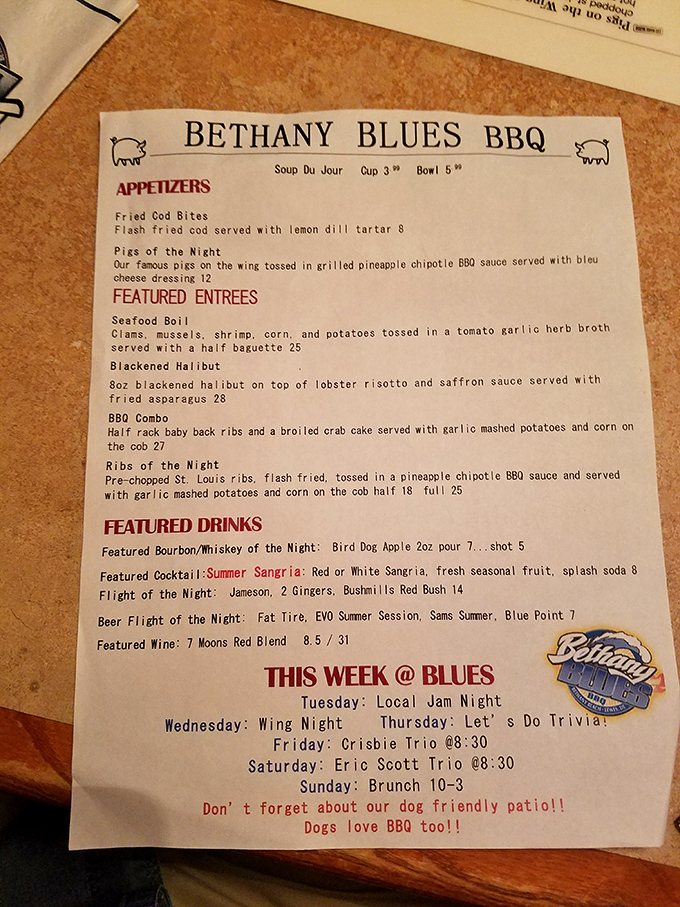 This menu isn't just a list of food&mdash;it's a roadmap to happiness with temptations like "Pigs of the Night" and a dog-friendly patio announcement that seals the deal.