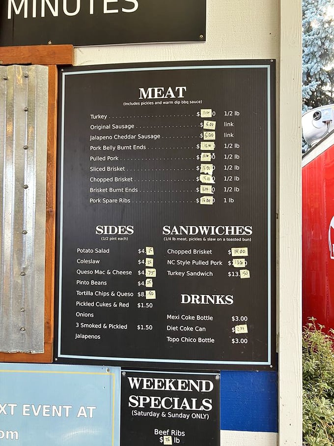 The menu board at Matt's tells a simple story: meat, sides, and happiness. No fancy descriptions needed when the food speaks this loudly.