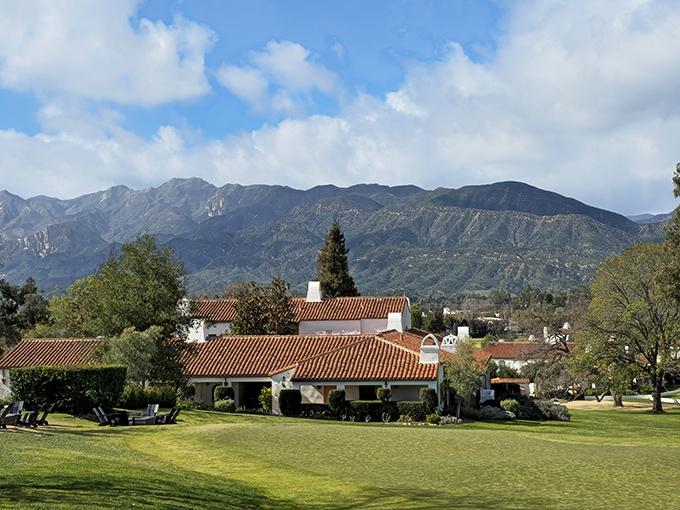 Terra cotta roofs and manicured lawns of the Ojai Valley Inn create a Mediterranean dreamscape against the mountain backdrop—luxury that somehow feels completely unpretentious.