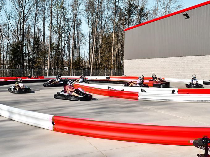 Where rubber meets road and weekend warriors transform into racing legends. The track's red and white barriers aren't just for show.