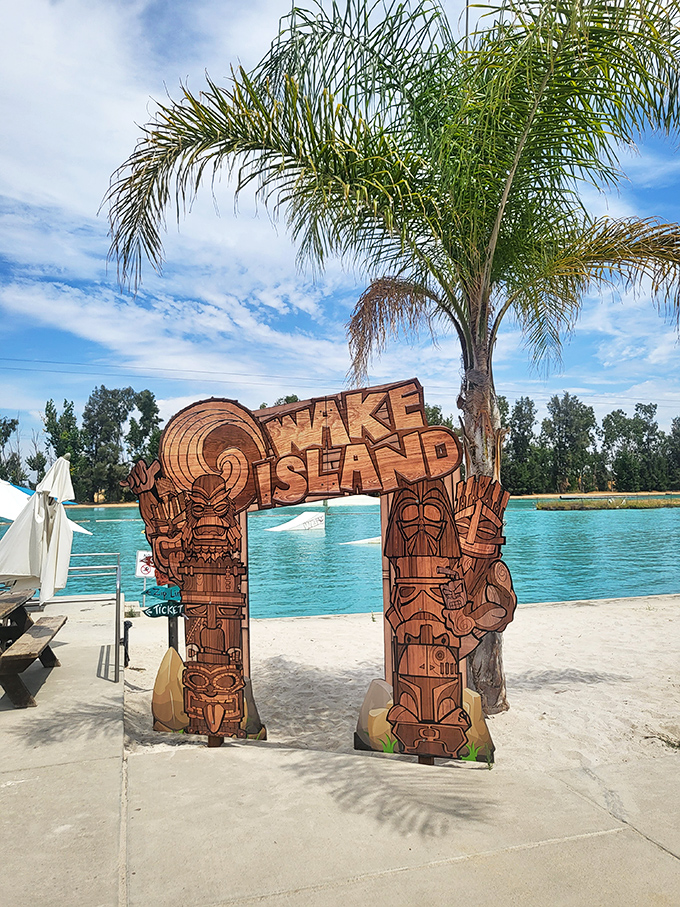 This wooden archway isn't just an entrance&mdash;it's a portal to your childhood dreams, complete with tiki carvings that seem to say, "Yes, adults can play here too."