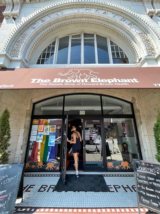 The welcoming entrance features the iconic elephant logo, with Pride flags signaling this isn't your grandmother's thrift store.