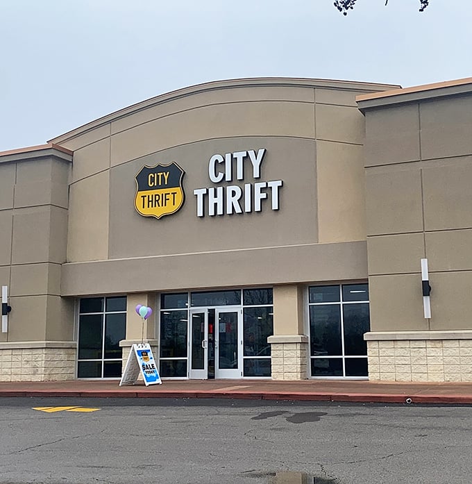 The distinctive City Thrift shield logo welcomes visitors like an old friend, promising a day of discovery behind those glass doors.