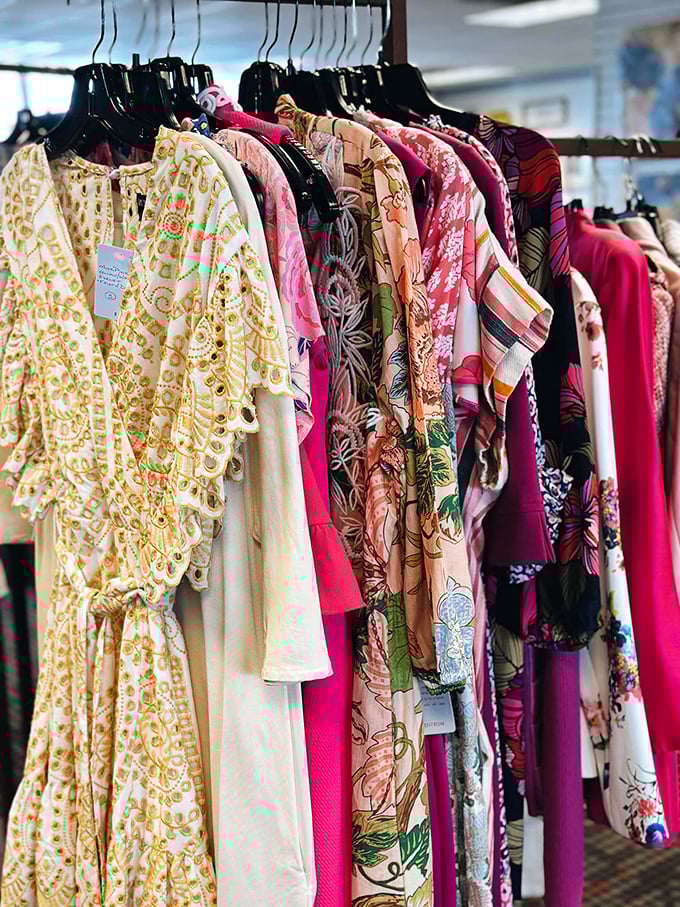 A rainbow of patterns tells stories of previous lives. Each dress whispering, "Take me home, I still have parties to attend!"