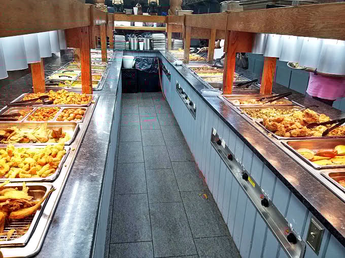 The buffet line at Ole Times stretches like a highway of Southern delights. Each steam tray holds treasures that would make your grandmother nod in approval.