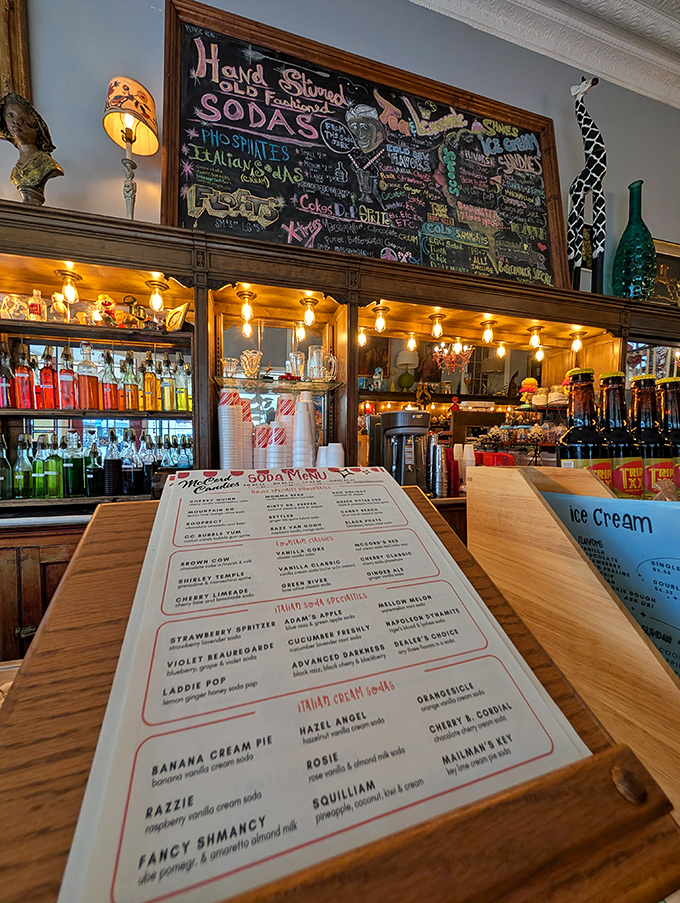 That chalkboard menu isn't just listing sodas &ndash; it's offering a passport to your childhood, with concoctions bearing whimsical names like "Violet Beauregarde" and "Advanced Darkness."