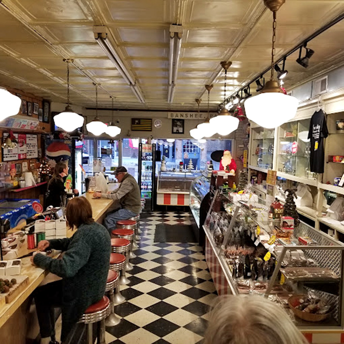 The red counter stools aren't just seats; they're front-row tickets to Pennsylvania's most delicious show, where chocolate is always the star.