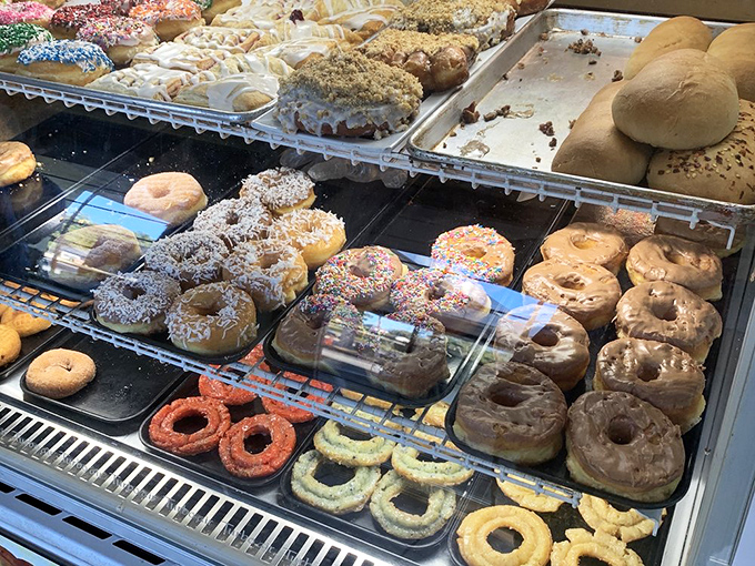 A donut artist's palette &ndash; each one a handcrafted masterpiece of dough, glaze, and sprinkles. Diet plans, beware.