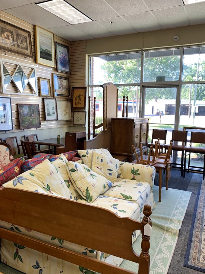 Someone's grandmother's floral couch awaits its second act, surrounded by furniture with more stories than a retirement community.
