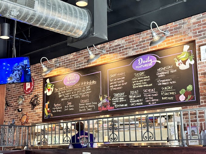 That chalkboard menu isn't just information—it's a roadmap to happiness. Daily specials that make Tuesday feel like a mini-vacation to New Orleans.