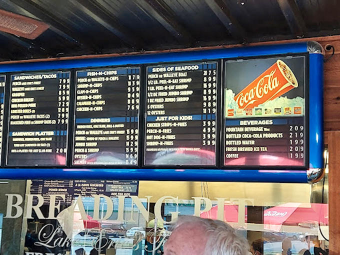 The menu board &ndash; a symphony of seafood possibilities. No fancy fonts or pretentious descriptions, just the honest promise of what might be your new favorite meal.