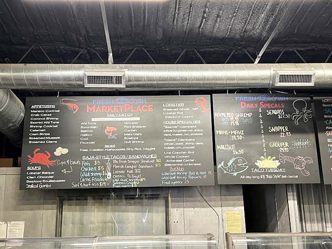 The chalkboard menu reads like a love letter to the ocean. Each carefully scripted item represents a promise of freshness that defies Bentonville's landlocked geography.
