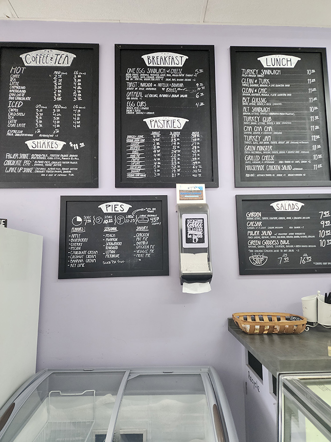 The chalkboard menu presents life's most important decision: which magnificent pie deserves your devotion today?