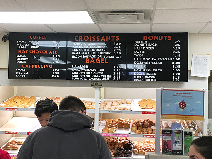 The menu board is a roadmap to happiness, offering everything from classic glazed donuts to breakfast sandwiches that'll make you rethink your morning routine.
