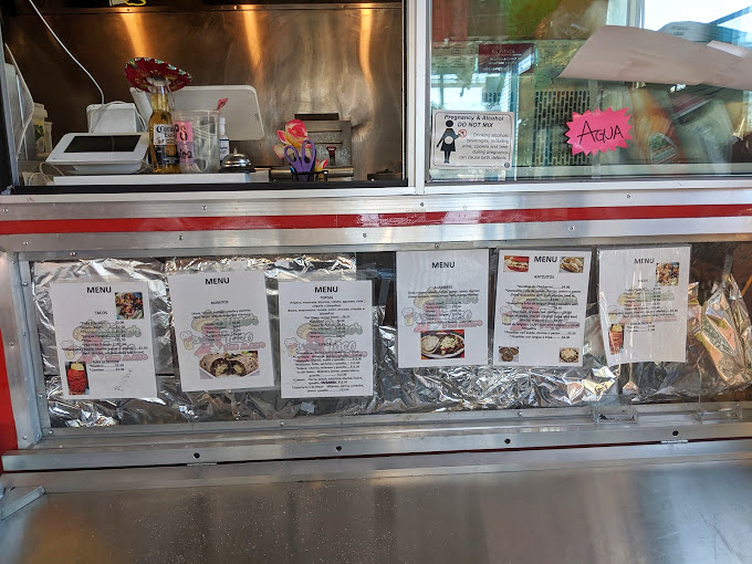 The refrigerated section glows like a beacon of refreshment, offering Mexican sodas that somehow taste exactly like childhood summers, even if you grew up in Oregon.