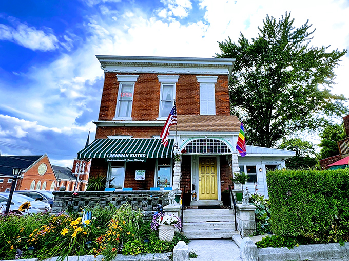 The LaBinnah Bistro welcomes visitors with classic brick architecture and blooming flowers&mdash;a charming spot where literary history meets modern cuisine.