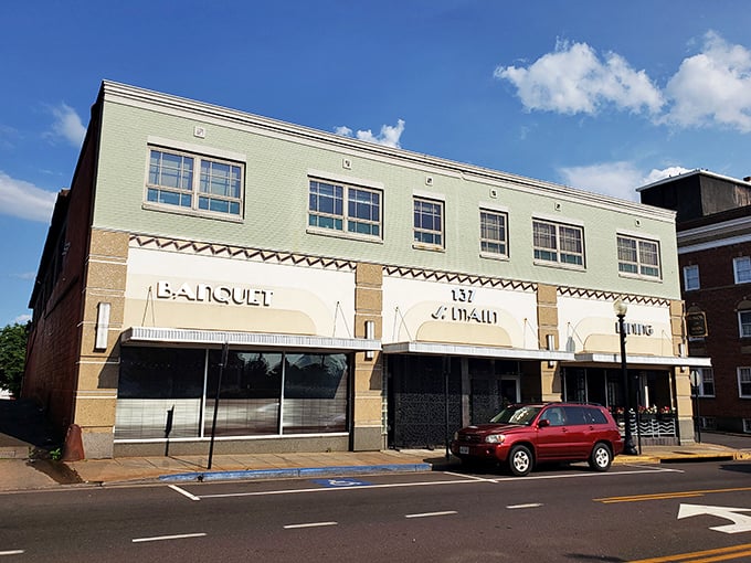 Banquet & Main's understated elegance whispers rather than shouts. That mint-green facade is the architectural equivalent of a palate cleanser between courses of brick.