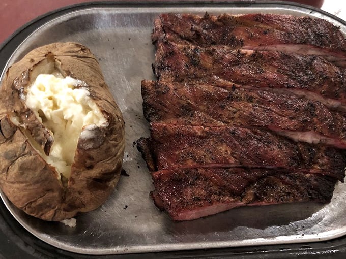 These ribs don't just fall off the bone&mdash;they practically leap onto your fork. The perfect smoke ring tells you everything you need to know about the pitmaster's skills.