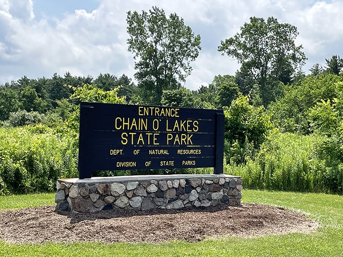The entrance sign stands like a promise of adventure. Your first hint that cell service might vanish&mdash;and that's the whole point.
