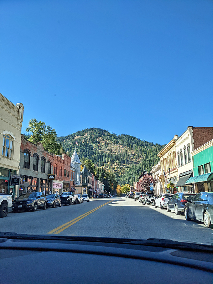 Mountains frame Wallace's main street like nature's own theater curtains, creating a stage for small-town charm that Broadway couldn't script better.