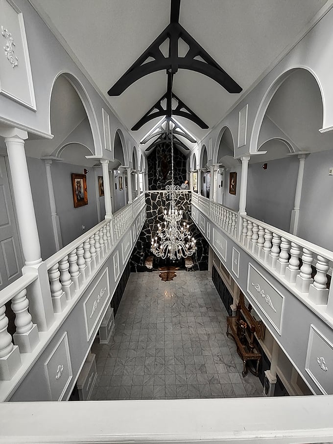 The second-floor gallery offers a breathtaking perspective of the great hall below, where centuries of architectural tradition meet modern craftsmanship.