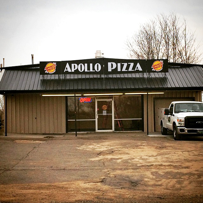 Apollo Pizza's humble storefront promises no frills, just thrills for your taste buds.