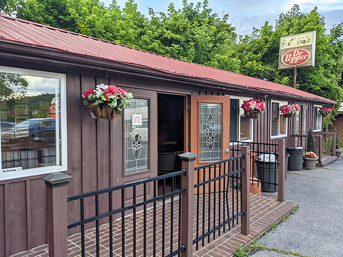 The Dip Dog Stand's rustic charm and hanging flower baskets&mdash;proof that hot dog paradise can look like a fairy tale cottage.
