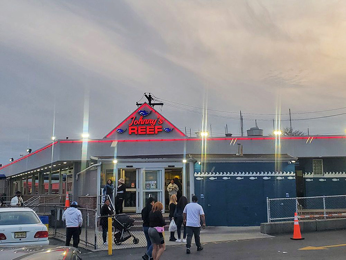 When that red neon sign glows at dusk, it's not just lighting up—it's calling you to one of City Island's most beloved seafood institutions.