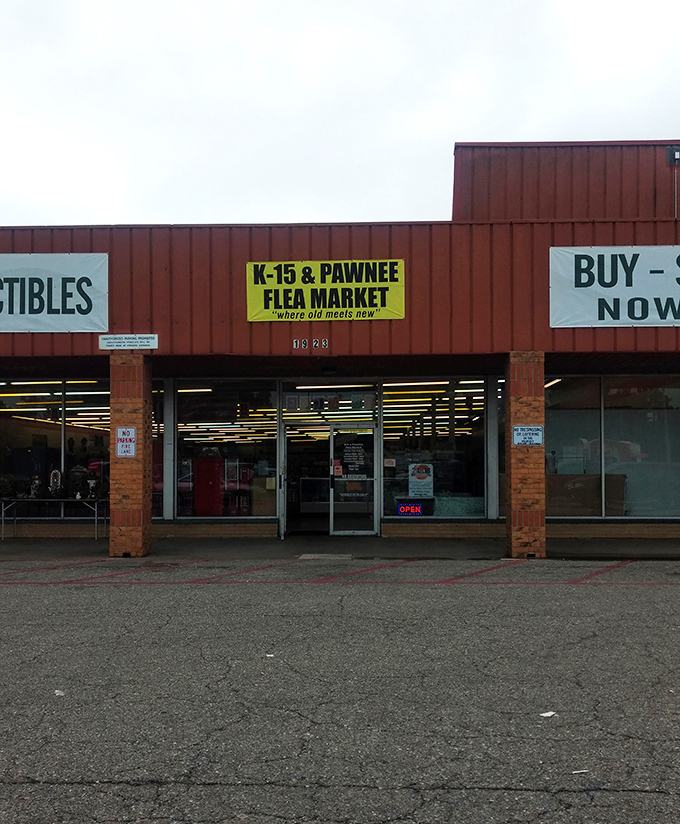 From above, the K-15 & Pawnee Flea Market reveals its true form: a labyrinth of potential discoveries where fluorescent lights illuminate forgotten treasures.