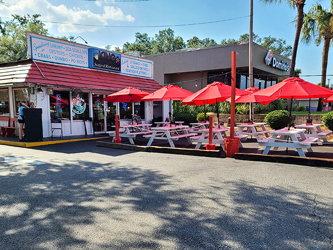 King Neptune's red umbrellas aren't just for shade&mdash;they're beacons for seafood lovers who know the best meals don't need fancy lighting.