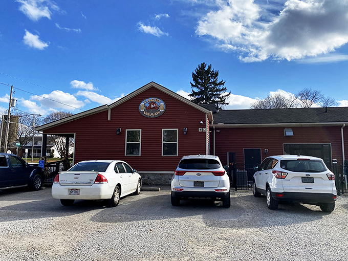 The bright red exterior of Lager Heads stands out like a beacon for barbecue pilgrims seeking smoky salvation.