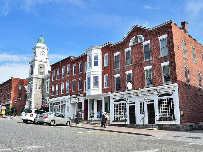 Litchfield's iconic town center, where the clock tower stands as both timekeeper and unofficial town mascot for generations of residents.