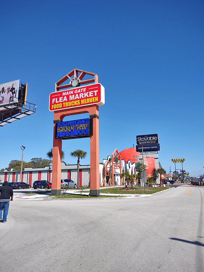 Main Gate's towering entrance sign promises a "Food Trucks Heaven" that delivers on its divine culinary prophecy.